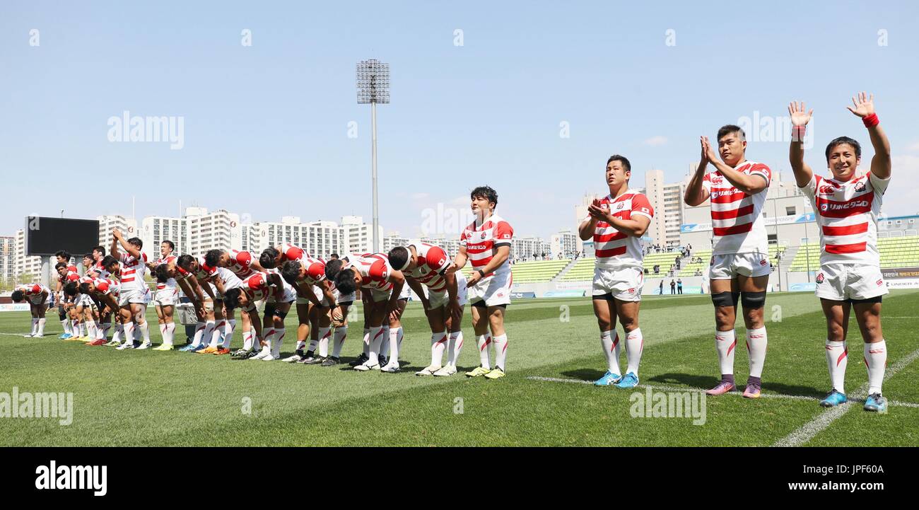 Members of Japan's Brave Blossoms national rugby team acknowledge the ...