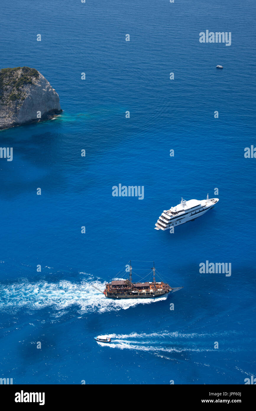 Tourist "pirate" ship Menia-Maria 1 and luxury yacht in the clear blue ...