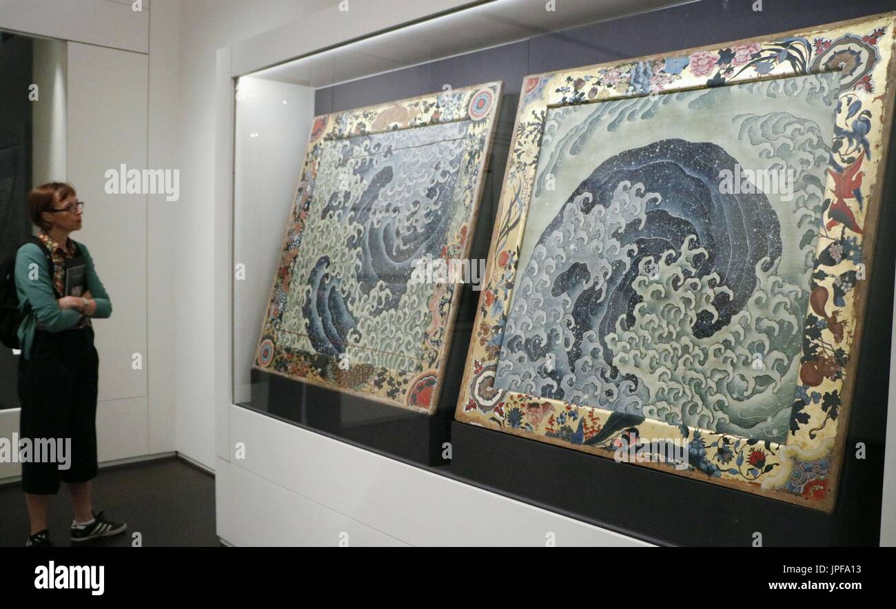 A woman looks at Japanese ukiyo-e artist Katsushika Hokusai's artwork ...