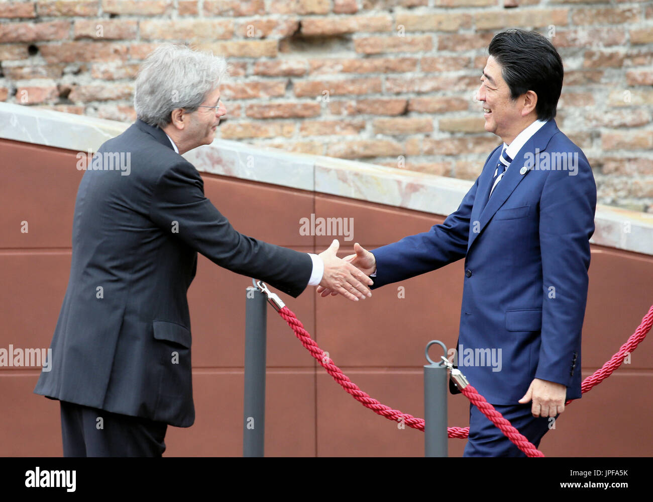 Italian Prime Minister Paolo Gentiloni (L) welcomes Japanese Prime ...