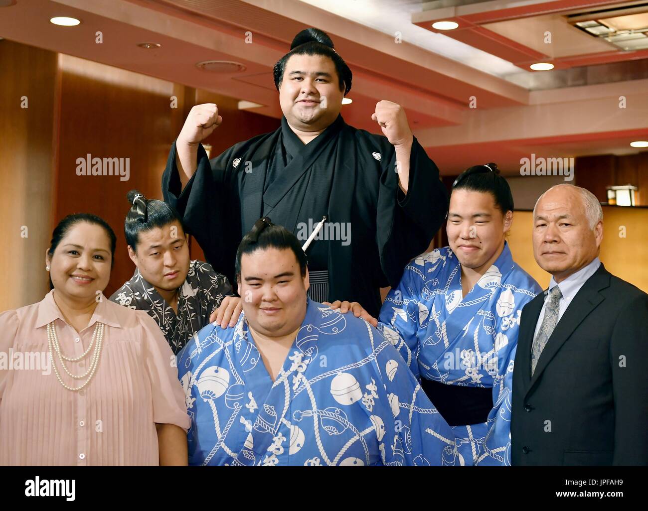 Sumo wrestler Takayasu poses for a photo with his father Eiji (R ...
