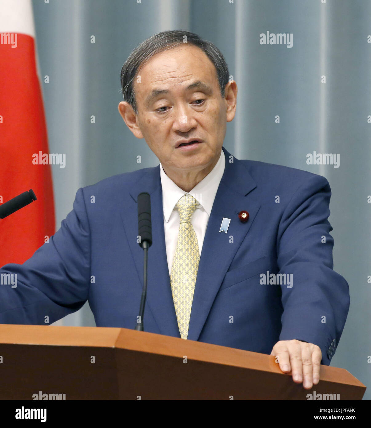 Japanese Chief Cabinet Secretary Yoshihide Suga says at a press ...