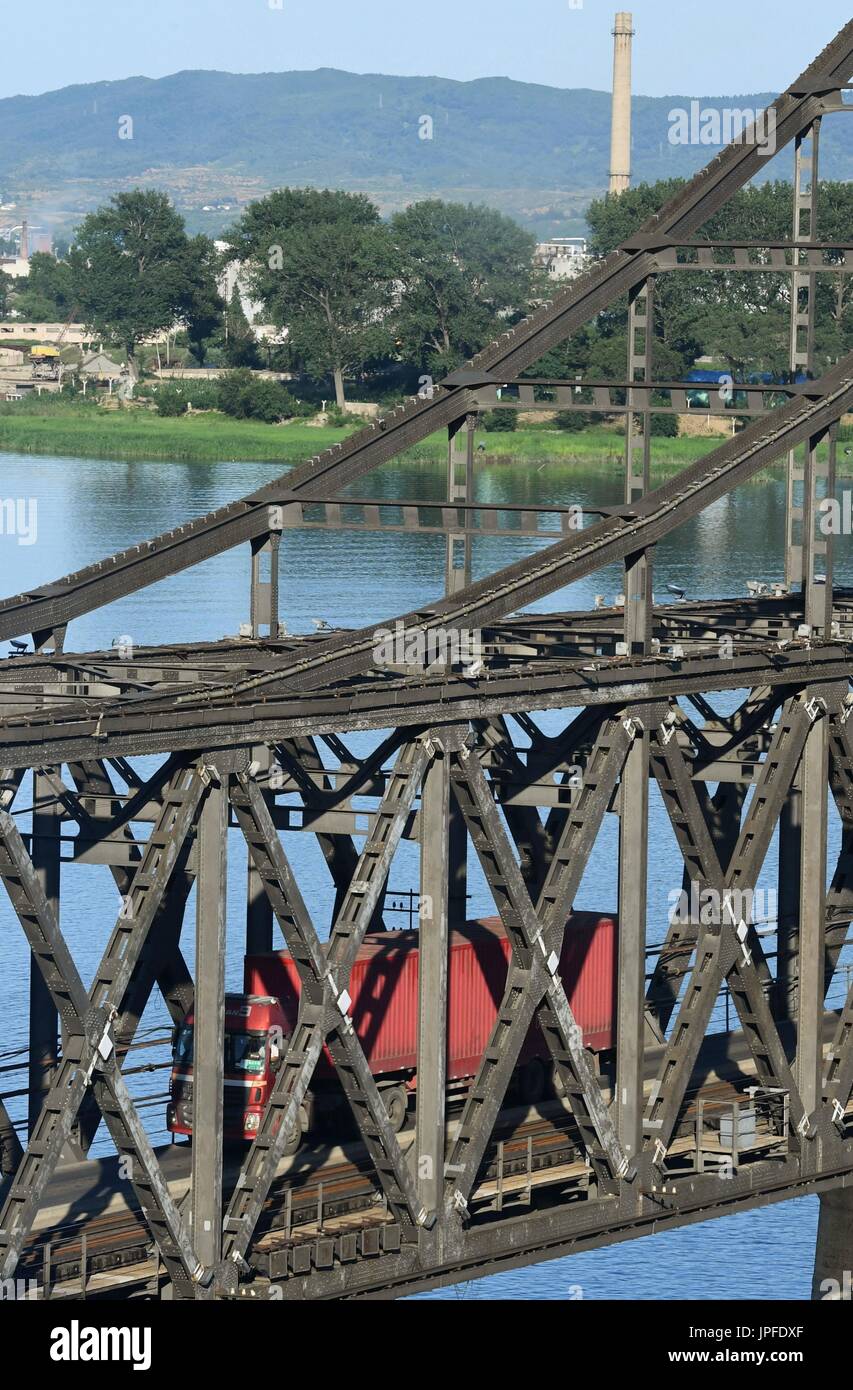 A truck runs across the Sino-Korean Friendship Bridge, connecting North ...