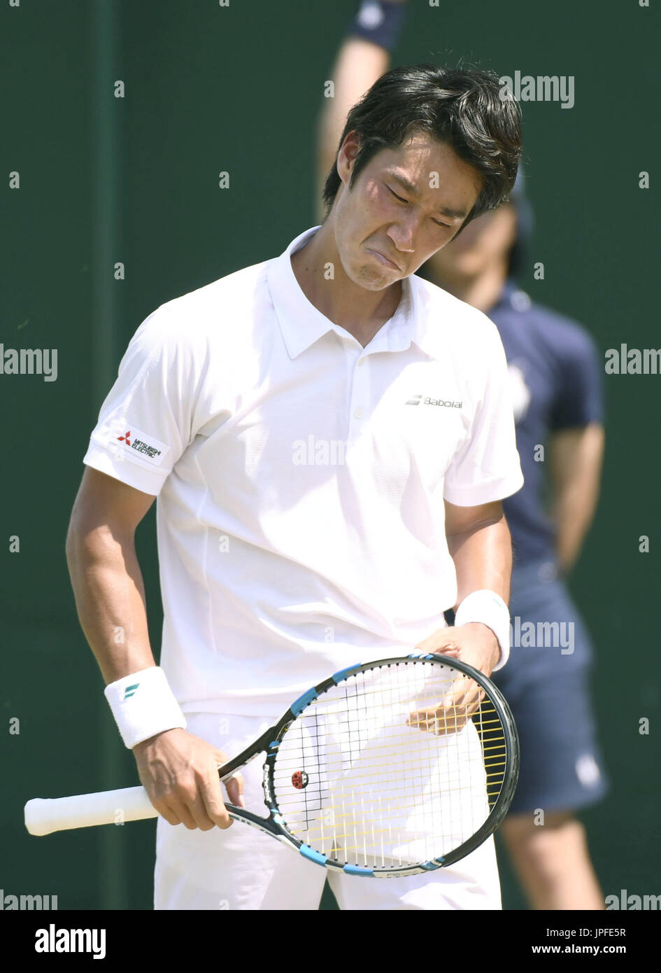 Yuichi Sugita of Japan reacts after losing a point during a Wimbledon second-round match against ...