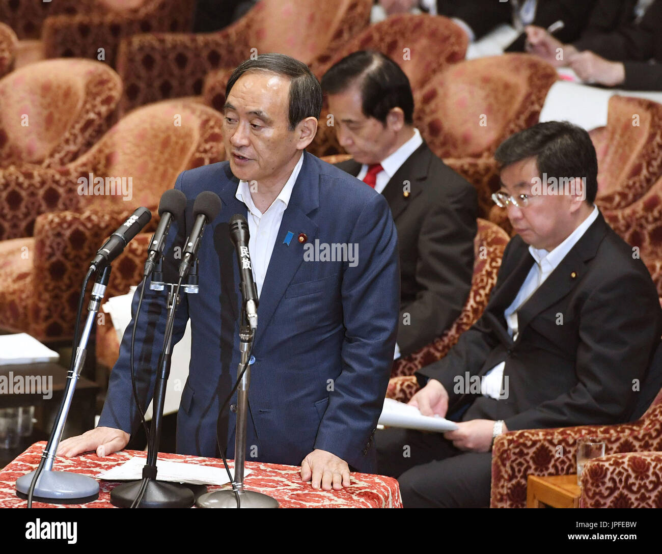 Chief Cabinet Secretary Yoshihide Suga speaks in a House of ...