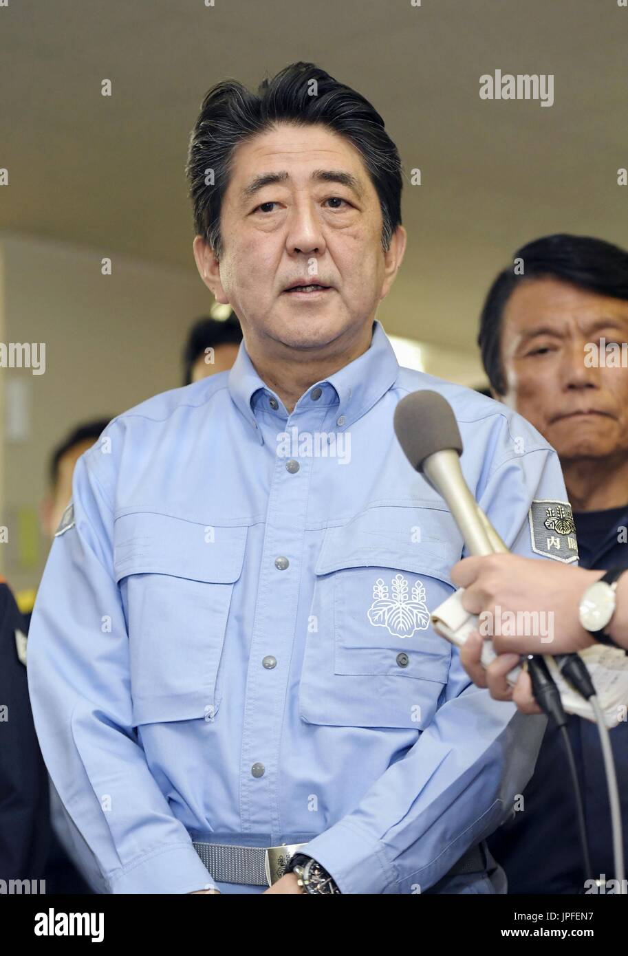 Prime Minister Shinzo Abe meets with reporters in the city of Asakura ...