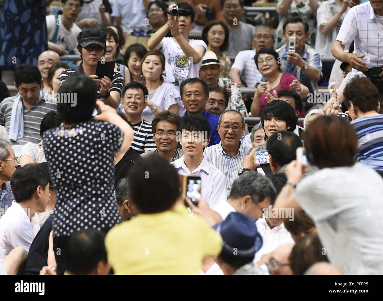 Record-breaking pro shogi Japanese chess player Sota Fujii (C), 14 ...