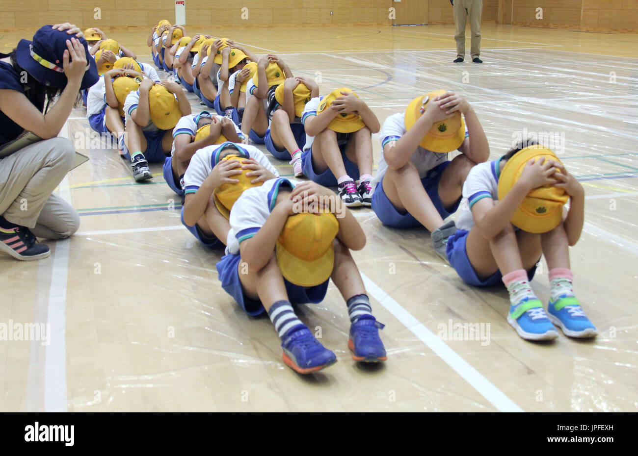Elementary school students participate in an evacuation drill in the ...