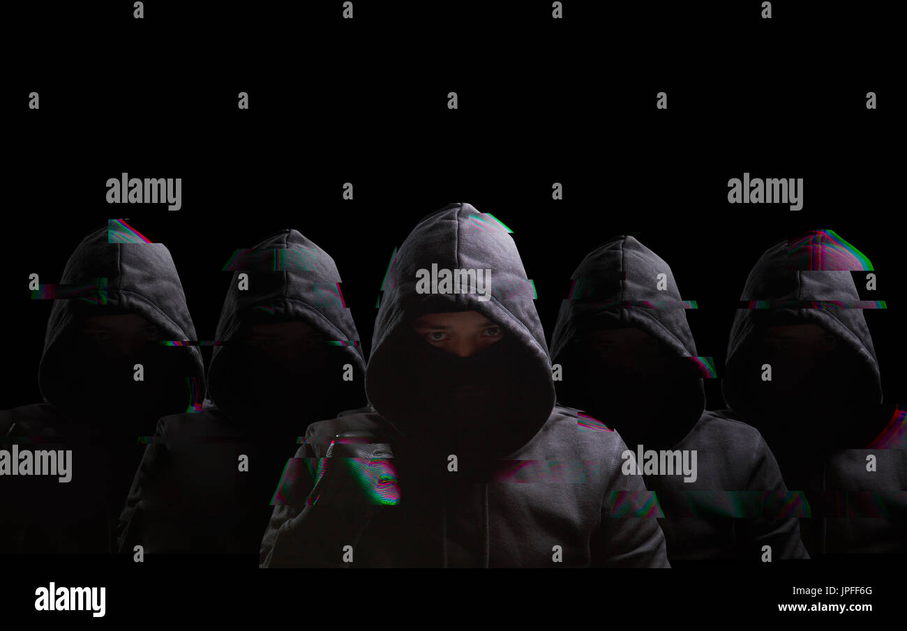 Many anonymous on black background Stock Photo - Alamy