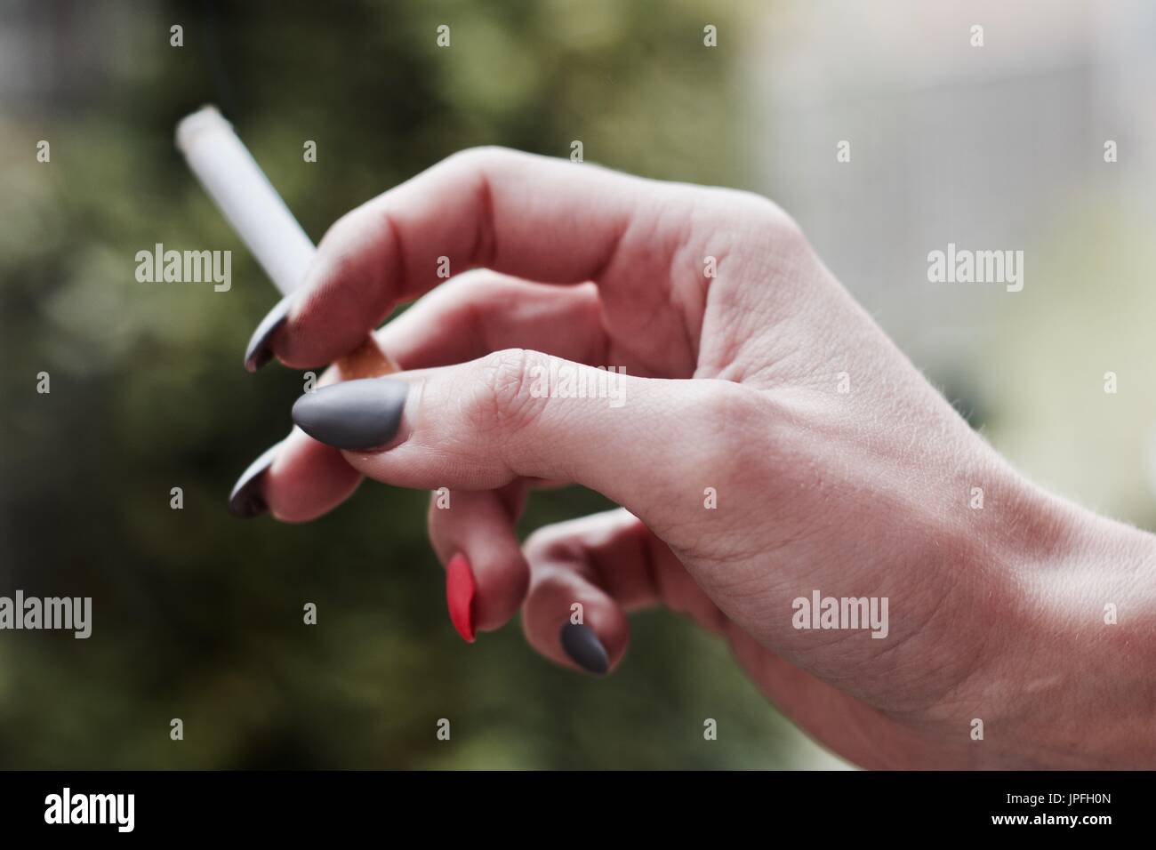 Nails cigarette hi-res stock photography and images - Alamy
