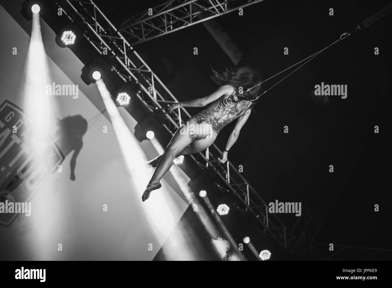 Miss Crash performs a suspention act during a Tattoo Convention on July ...