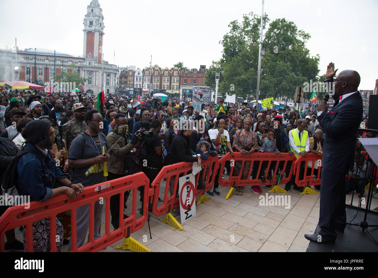London, UK. 1st Aug, 2017. People with banners and placards listen to ...