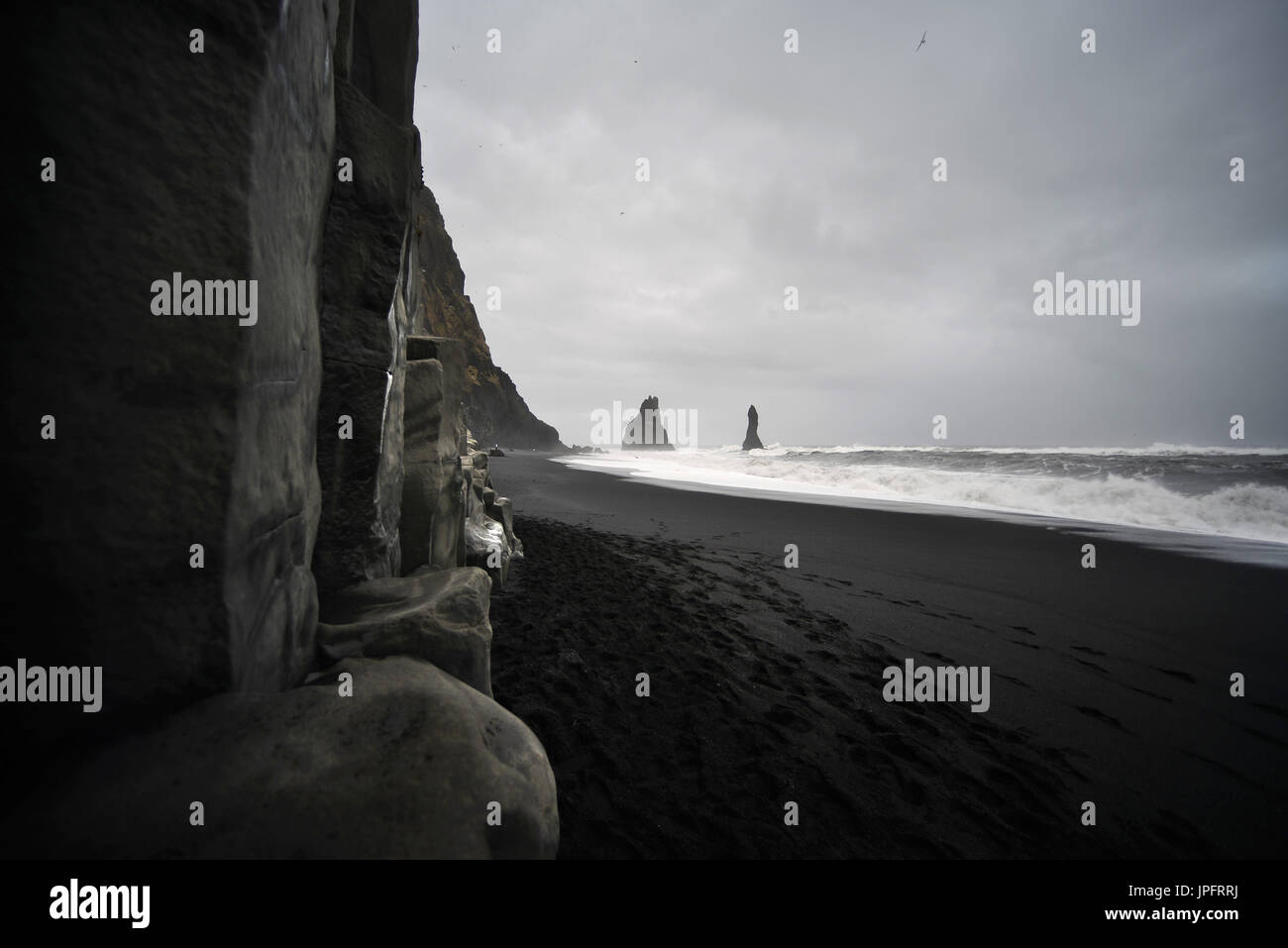 Reynisdrangar basalt sea rocks and black volcanic sand, Iceland Stock ...
