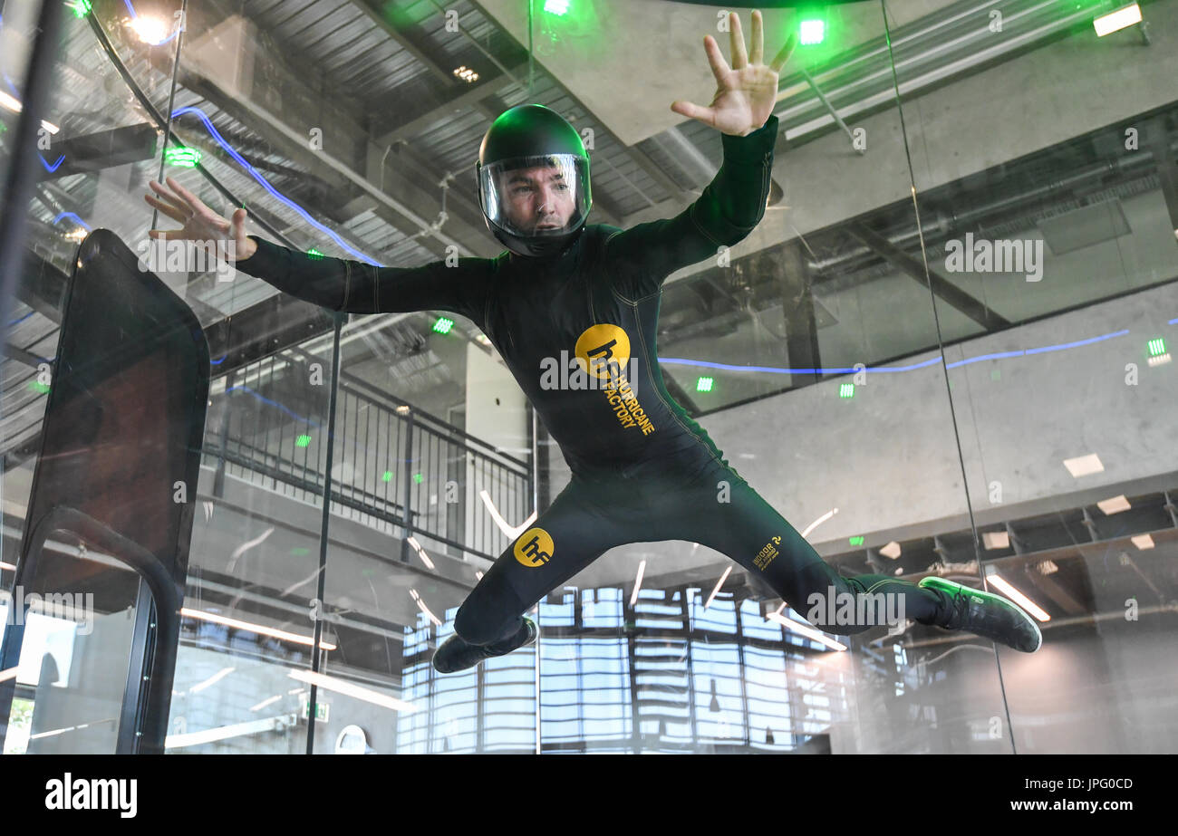 A man flies seemingly weightless in a wind tunel of the Hurricane ...