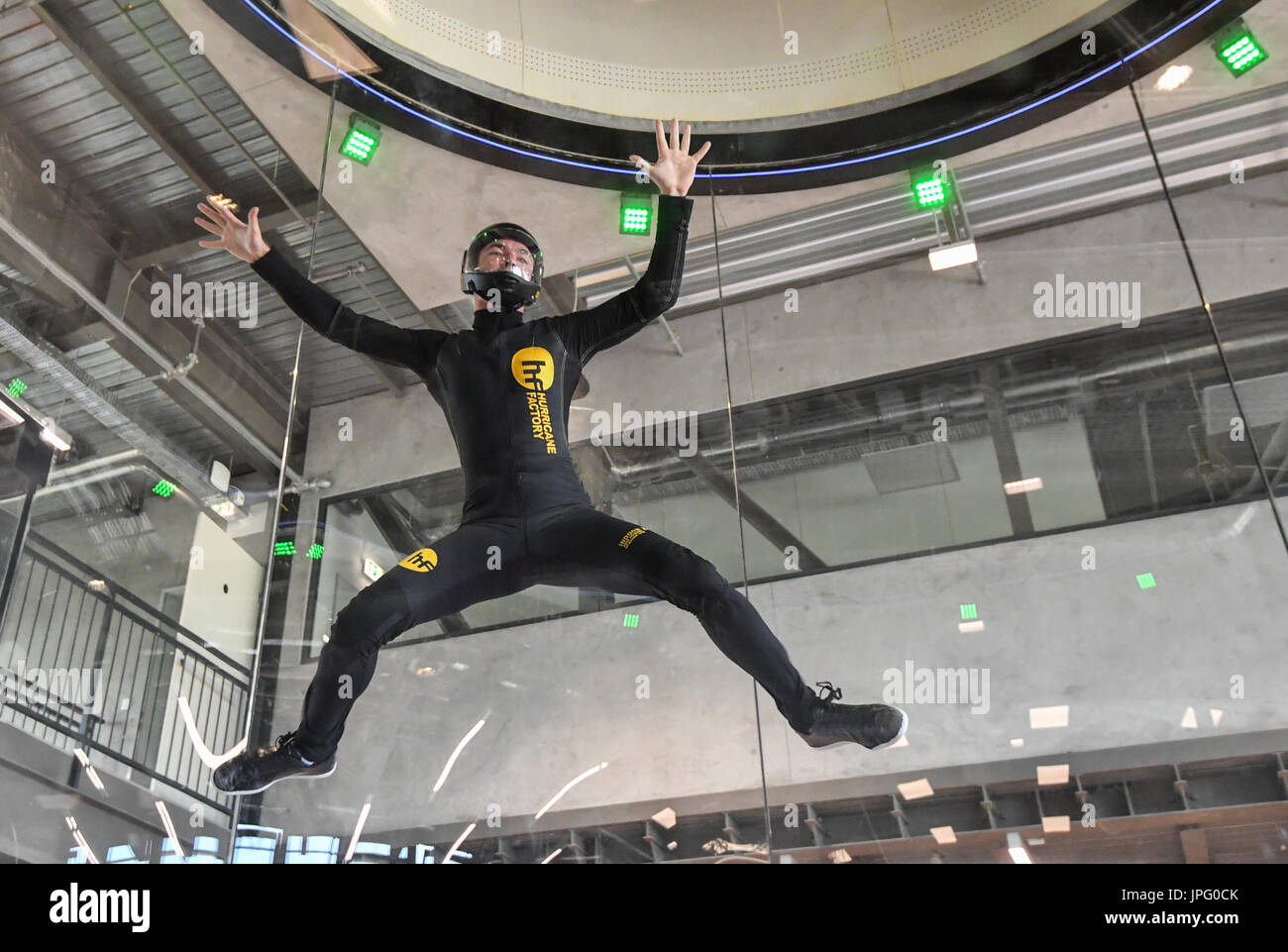 A man flies seemingly weightless in a wind tunel of the Hurricane ...