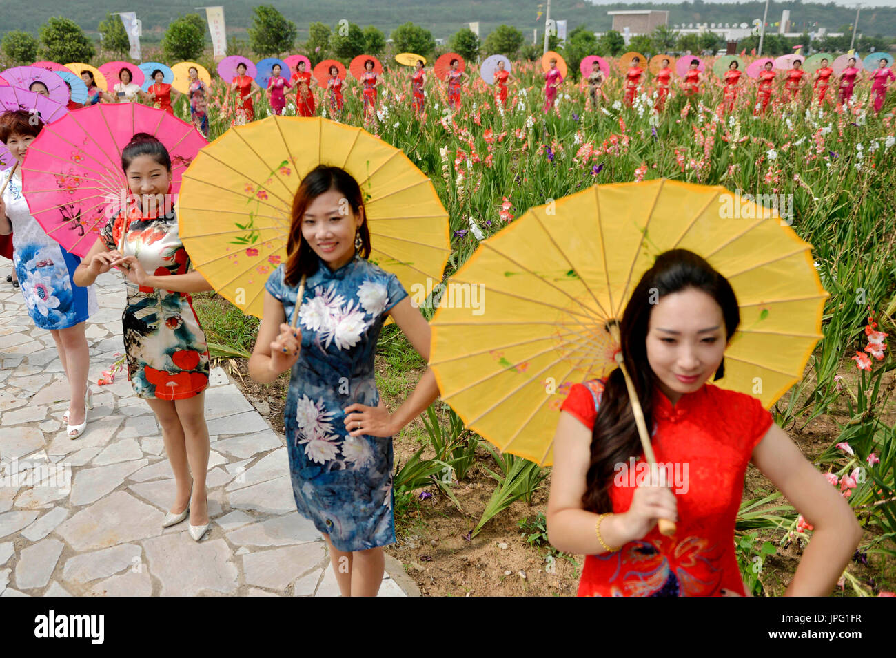 Shahe, China's Hebei Province. 2nd Aug, 2017. Women present cheongsam ...