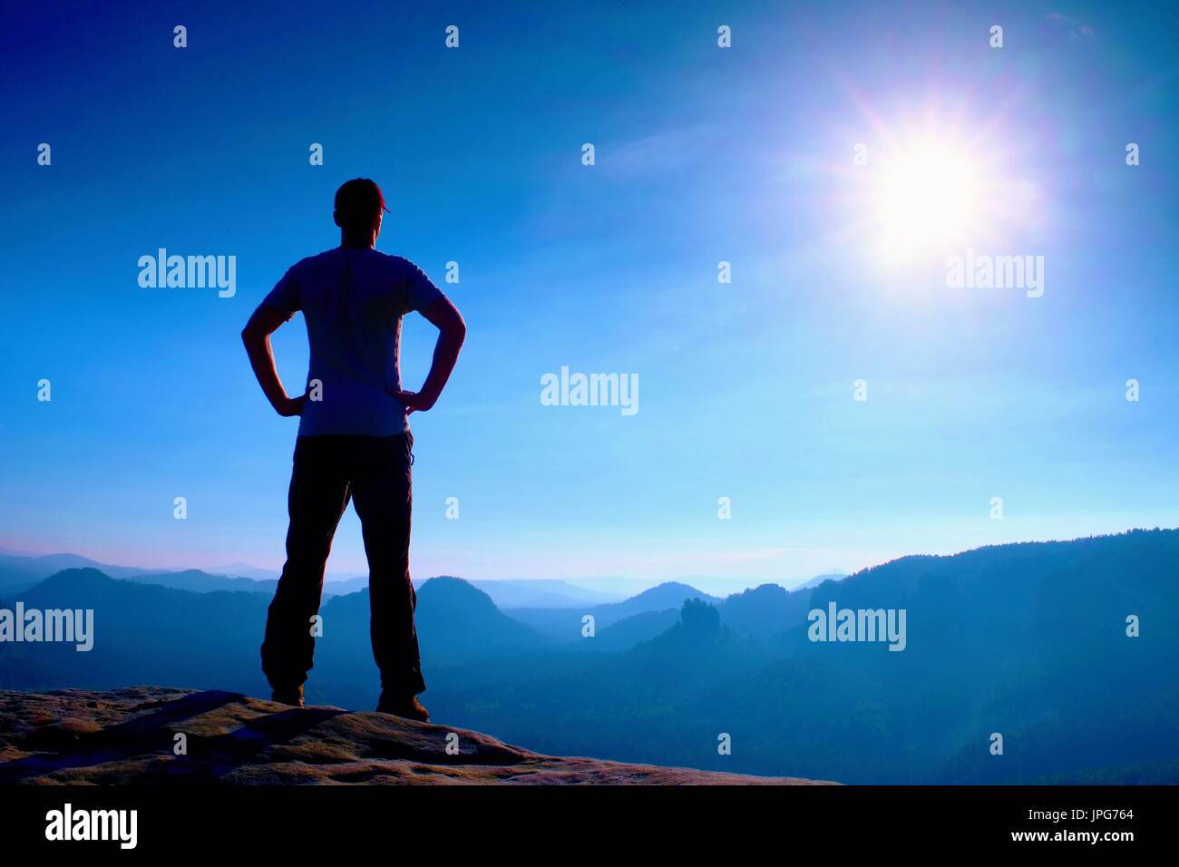 Self confident hiker on the peak of sandstone rock in rock empires park ...