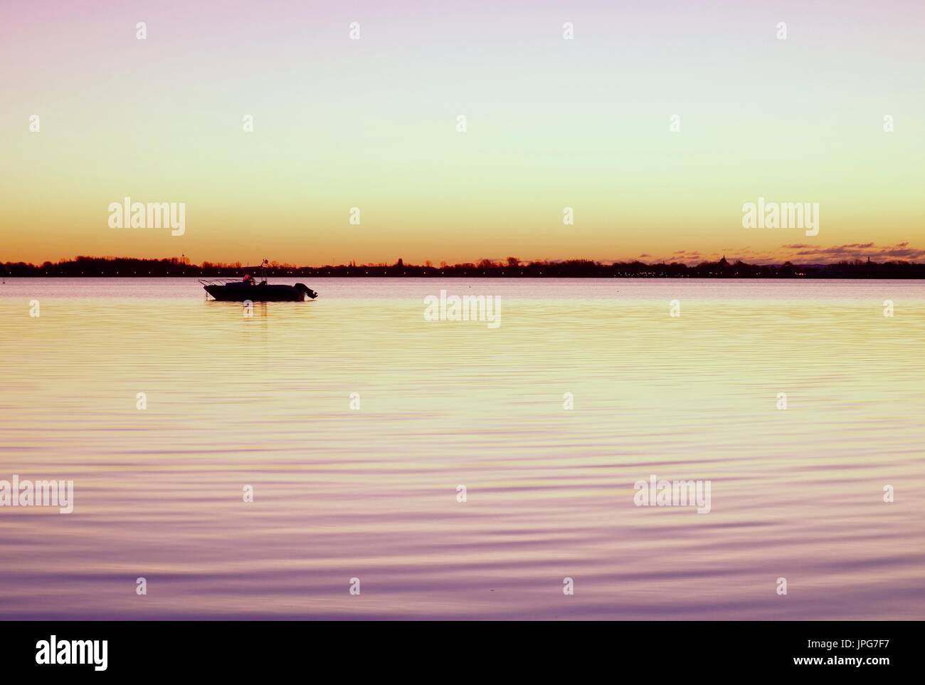 The first light of day creates dramatic colors in the sky over the sea ...