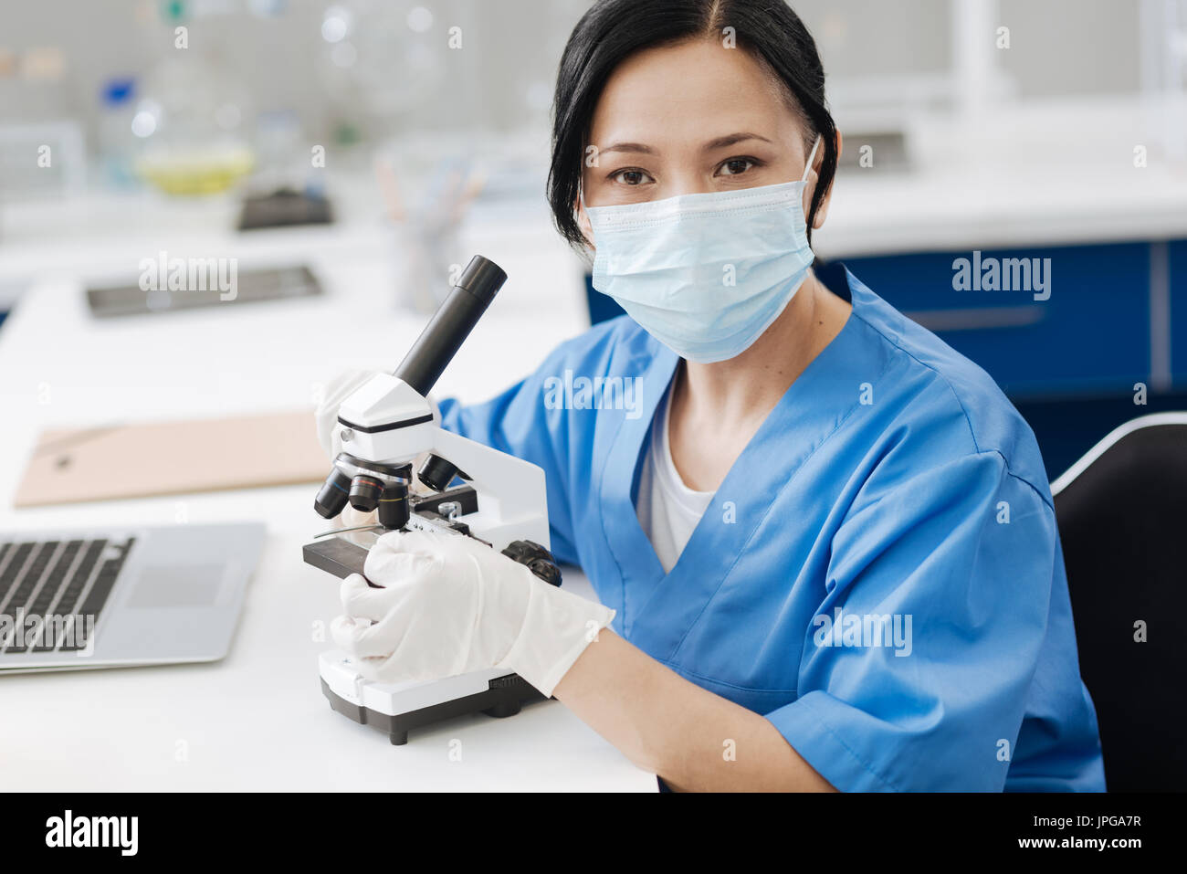 Pleasant professional biologist wearing uniform Stock Photo - Alamy