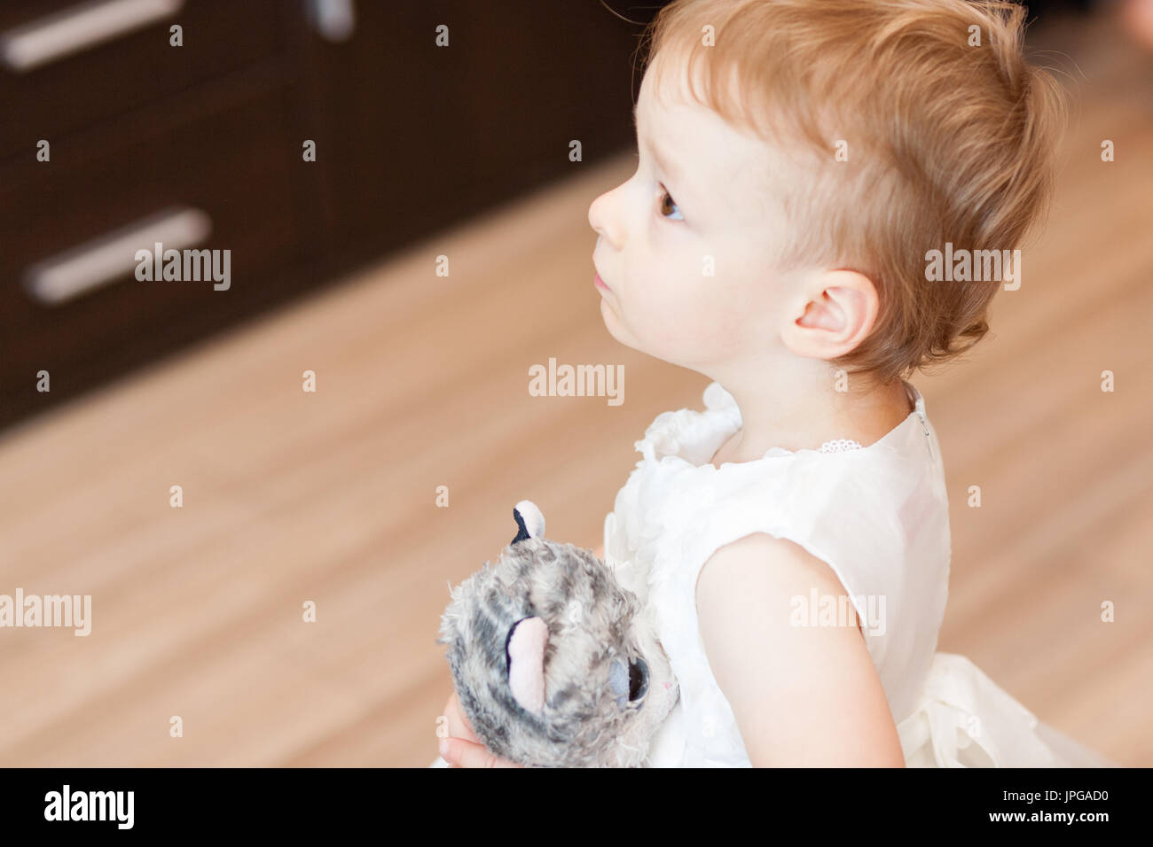 Baby prepared by mother with white ceremonial clothes. Baptism clothes ...