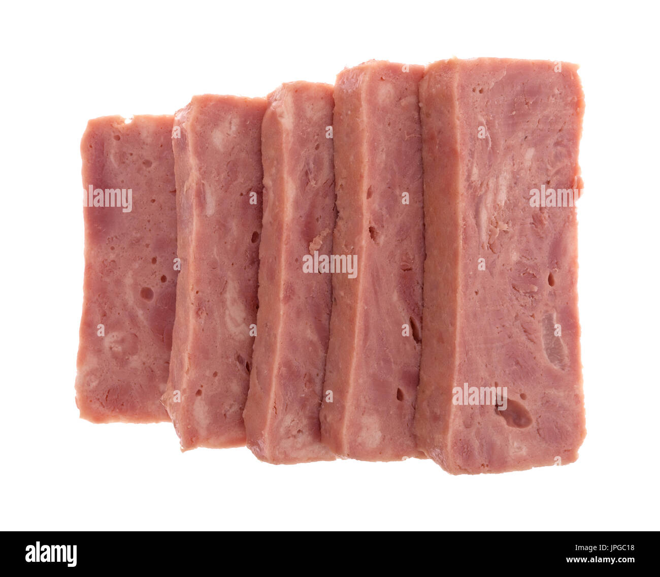 Top view of several thick slices of canned ham isolated on a white ...