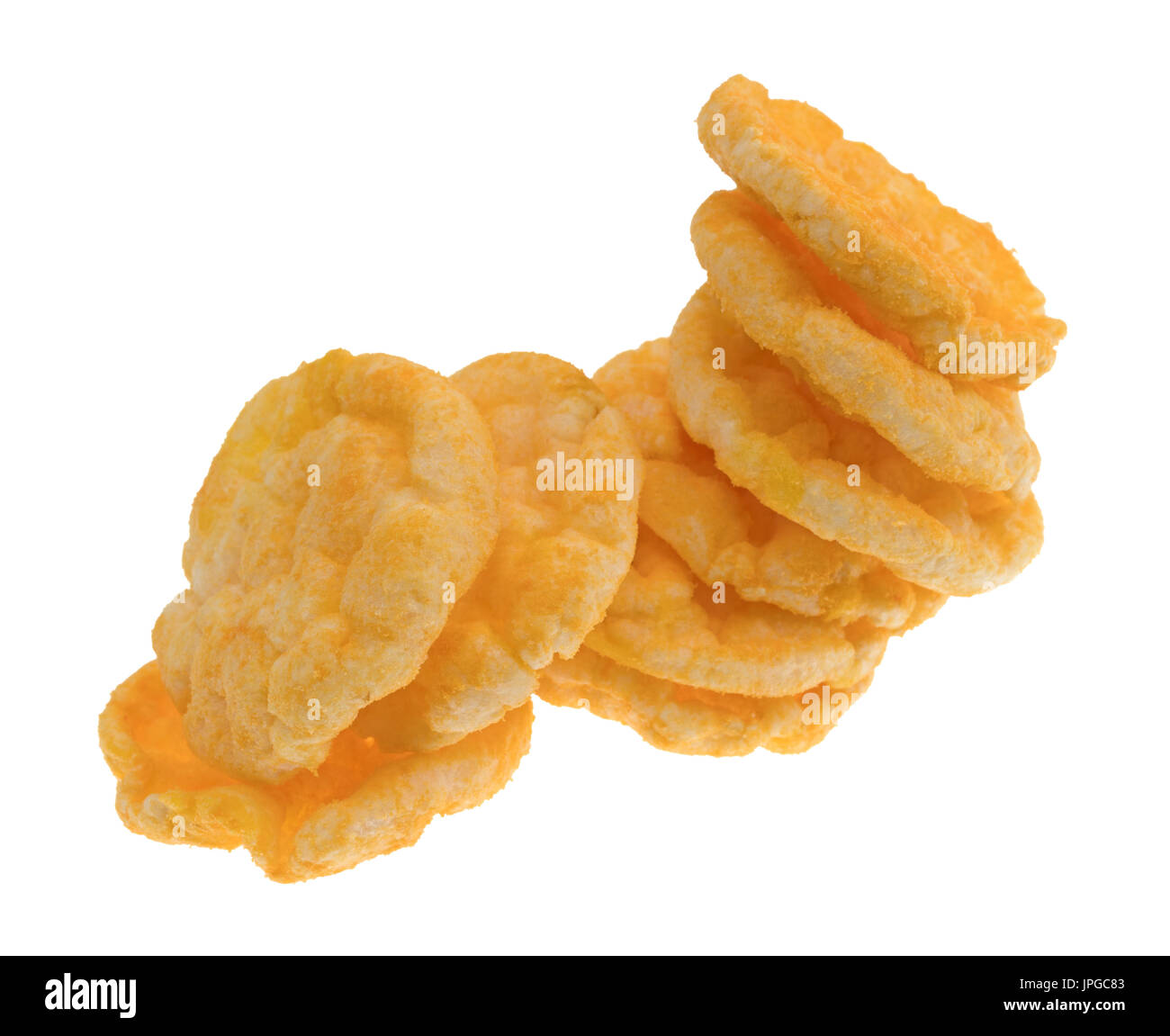Cheddar cheese rice cakes in a messy stack isolated on a white ...