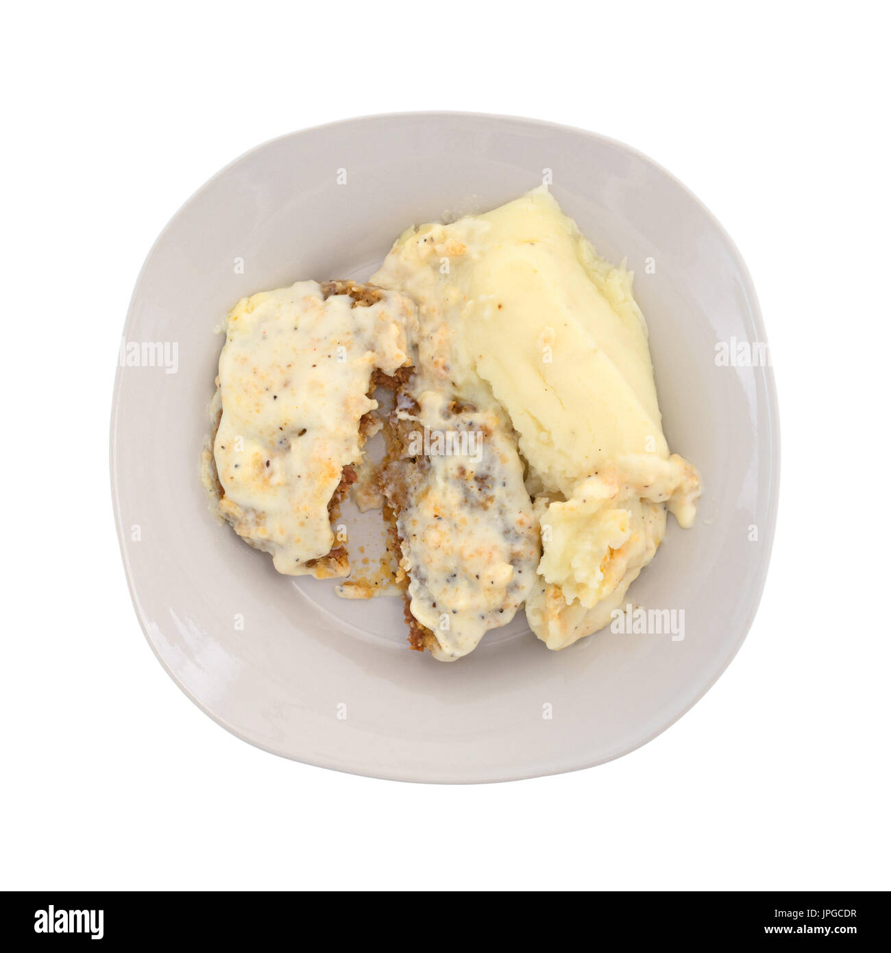 Top view of a fried beef steak in gravy with mashed potatoes meal on a ...