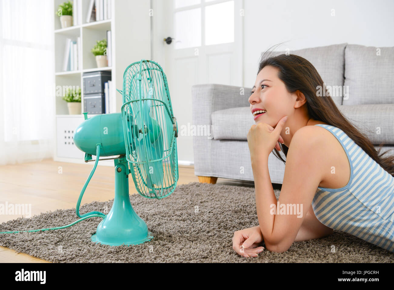 Woman cooling down fan hi-res stock photography and images - Alamy