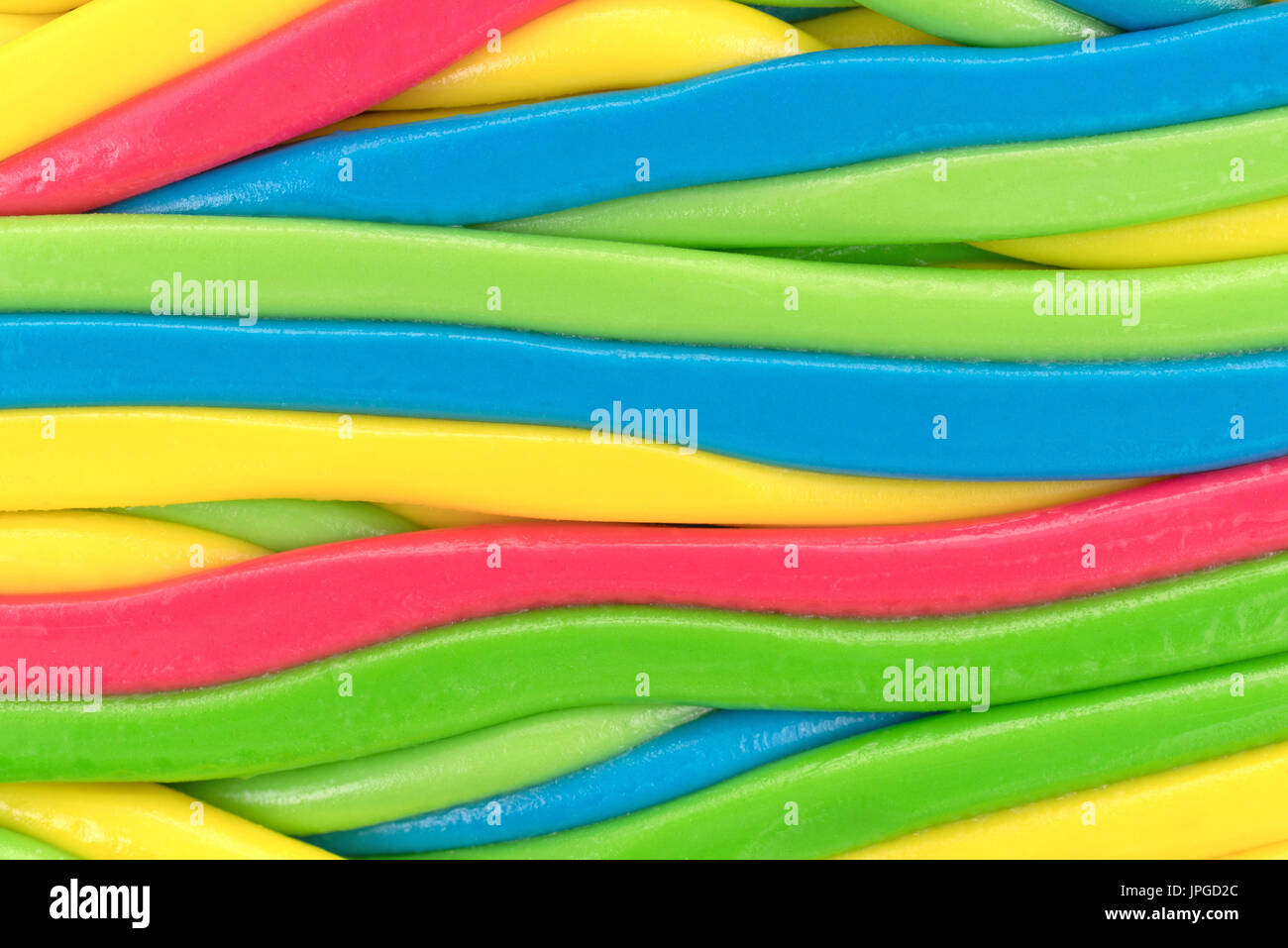 Very close view of several colorful candy strings Stock Photo - Alamy