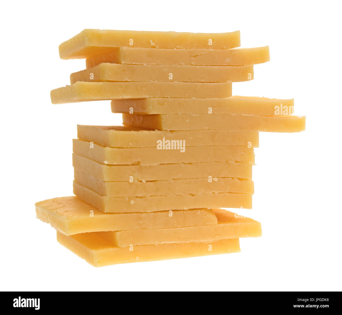 Messy stack of slices of gouda cheese isolated on a white background ...