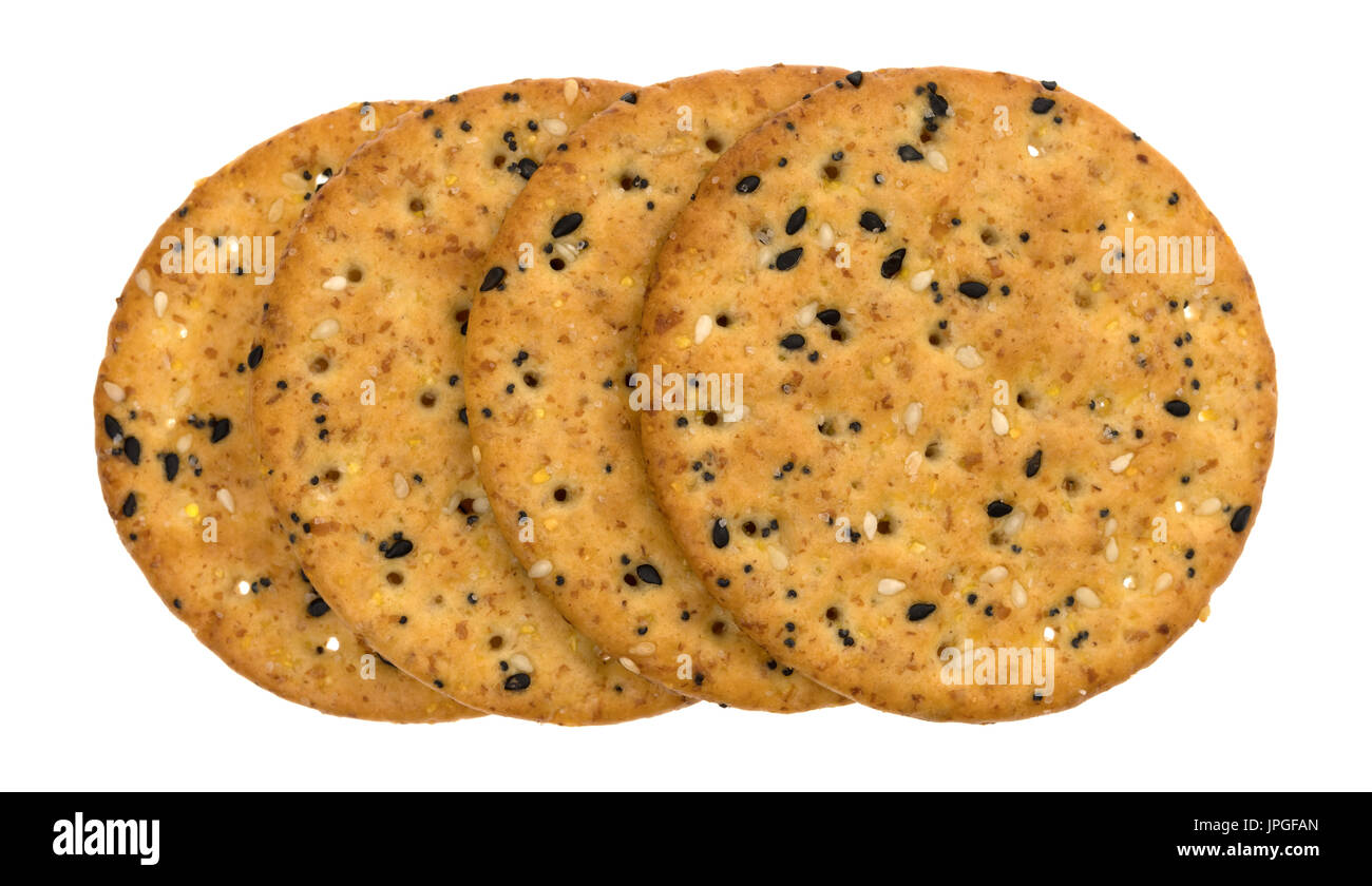 A short row of multi grain baked crackers isolated on a white ...