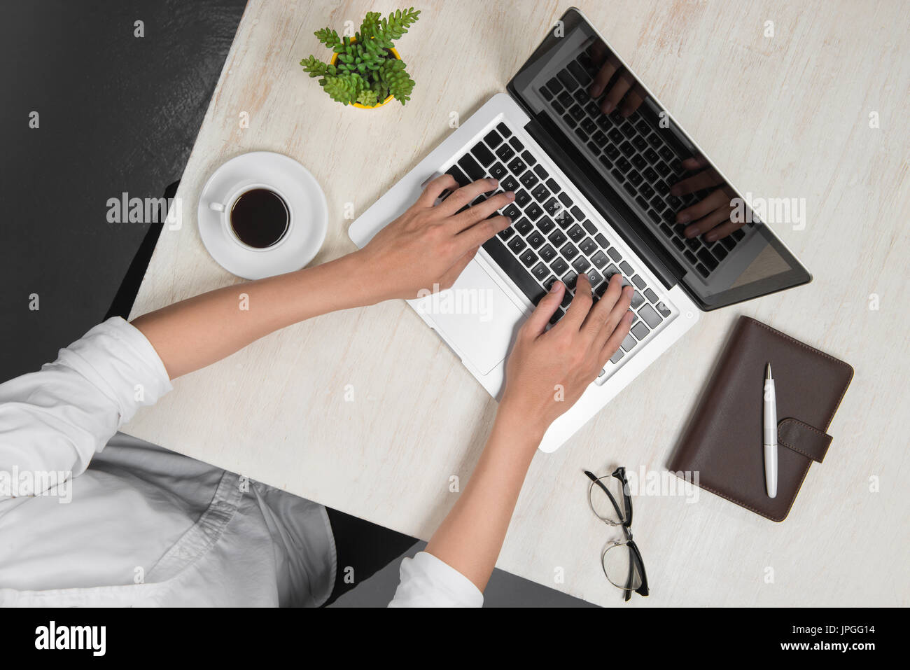 Top view of man using a modern portable computer in home office Stock ...