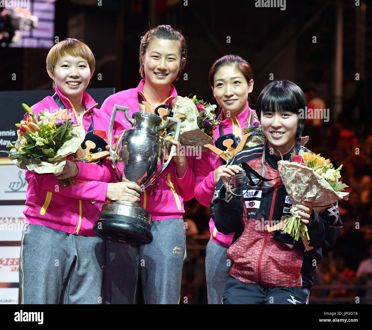 China's Ding Ning (2nd from L) poses for a photo after winning the ...