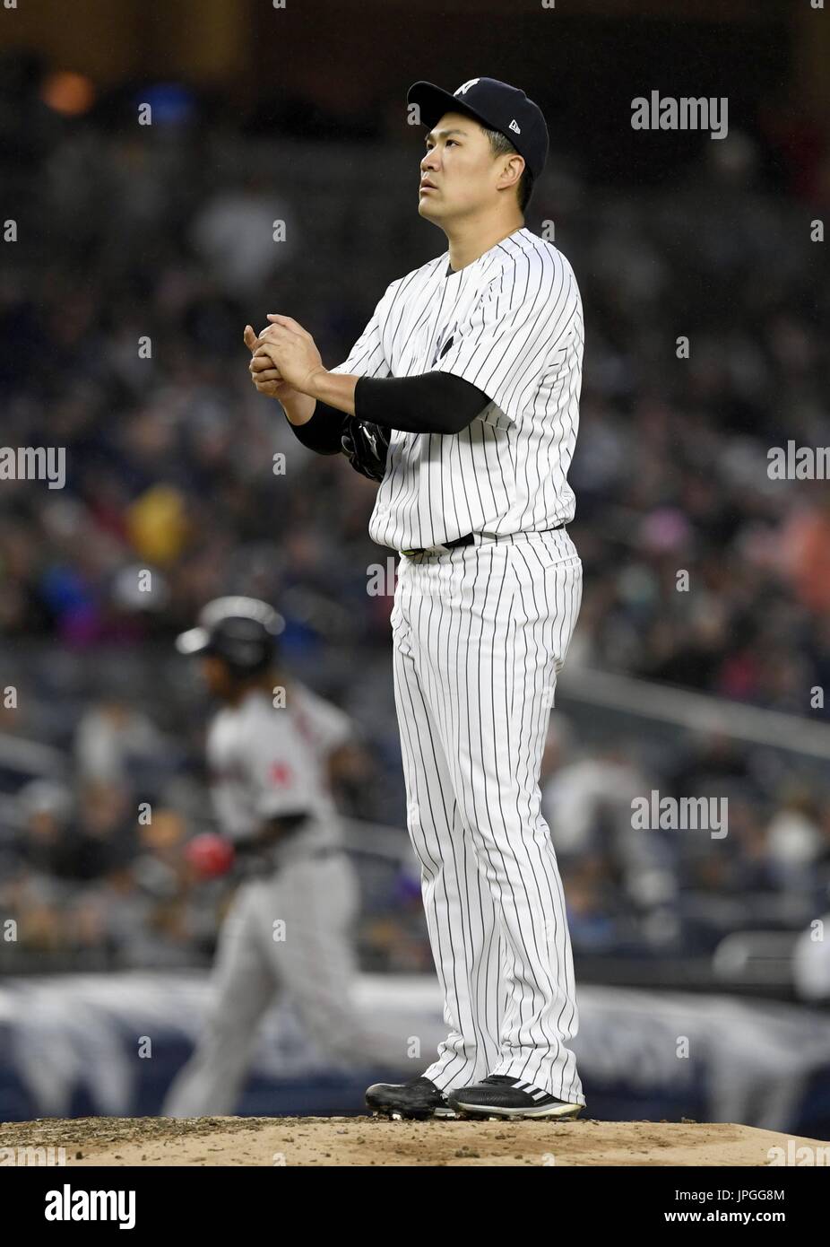 New York Yankees pitcher Masahiro Tanaka reacts after allowing second consecutive homer during ...
