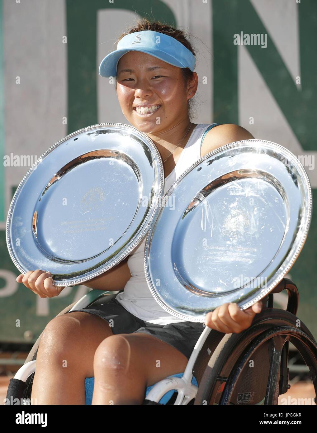 Yui Kamiji of Japan poses for photos after winning the singles and ...