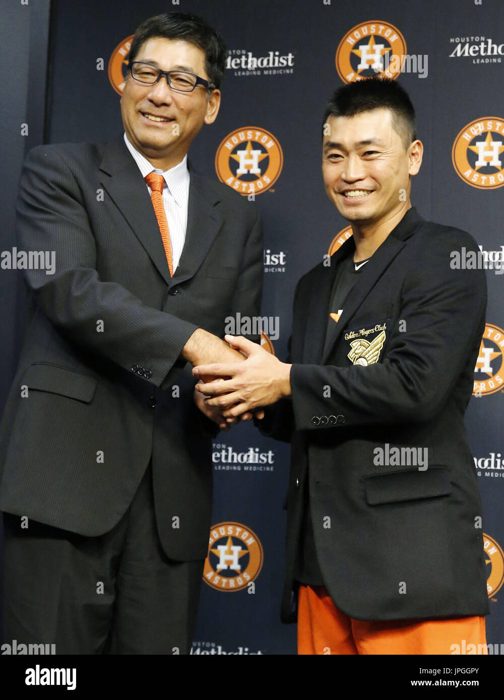Houston Astros outfielder Norichika Aoki (R) receives a ceremonial ...
