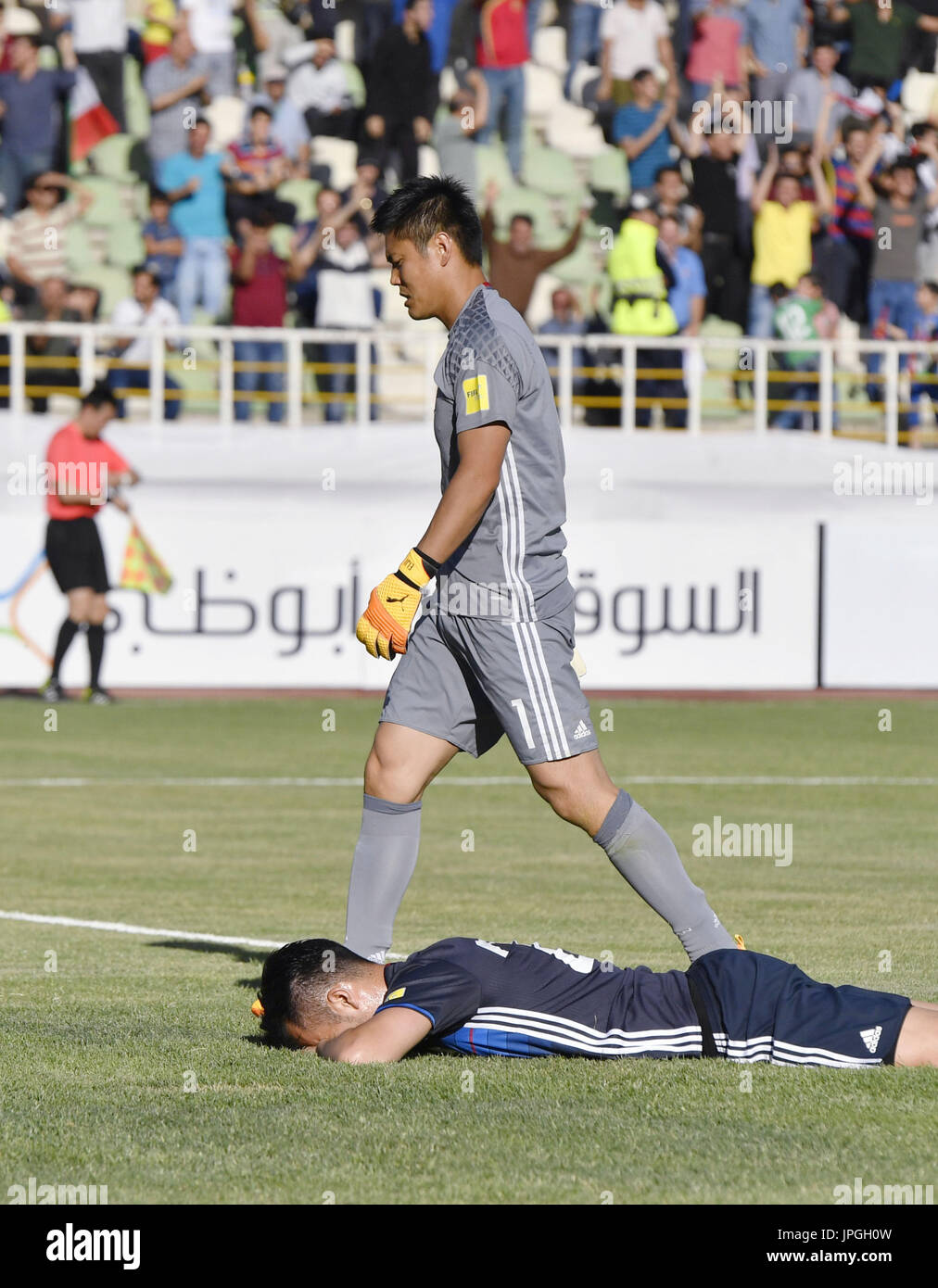 Japan goalkeeper Eiji Kawashima (standing) and defender Maya Yoshida ...