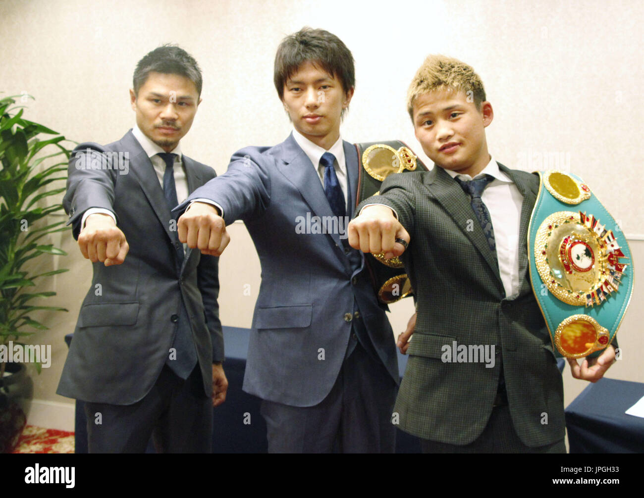 WBA light flyweight champion Ryoichi Taguchi (C) of Japan poses for a ...