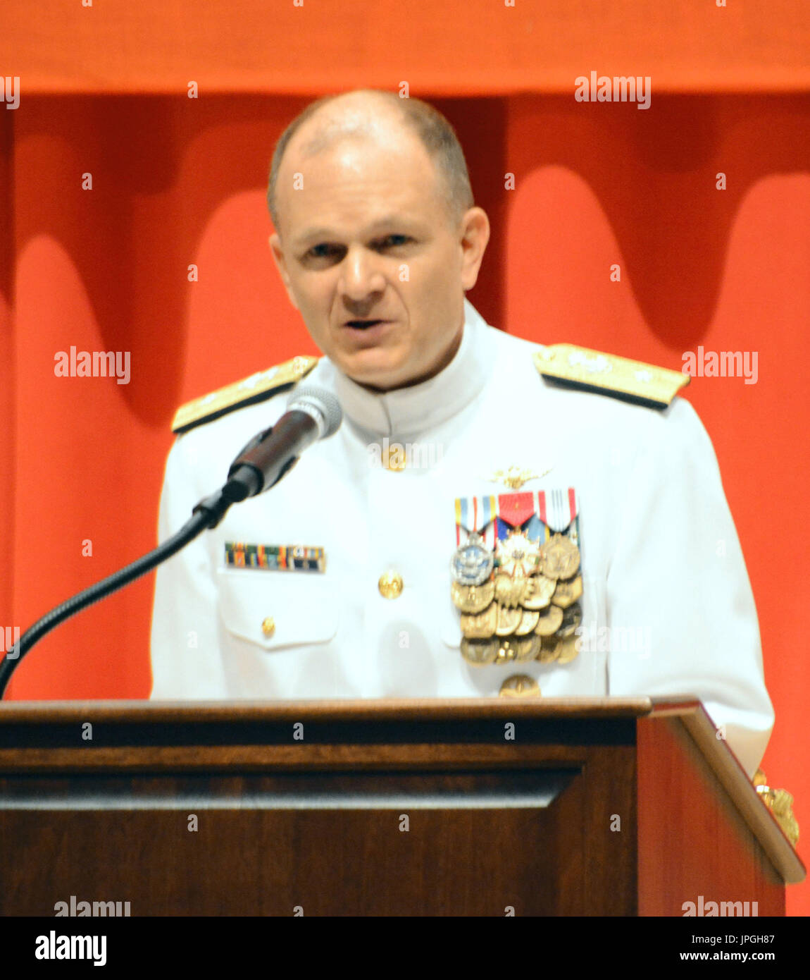 Rear Adm. Gregory Fenton addresses a ceremony at the Yokosuka naval ...