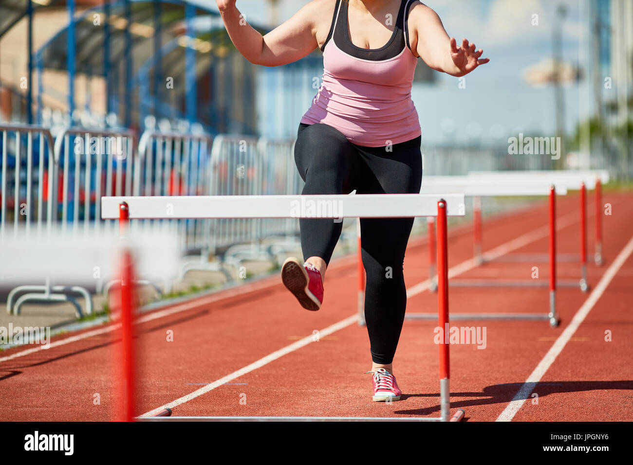 Hurdle race woman barrier hi-res stock photography and images - Alamy