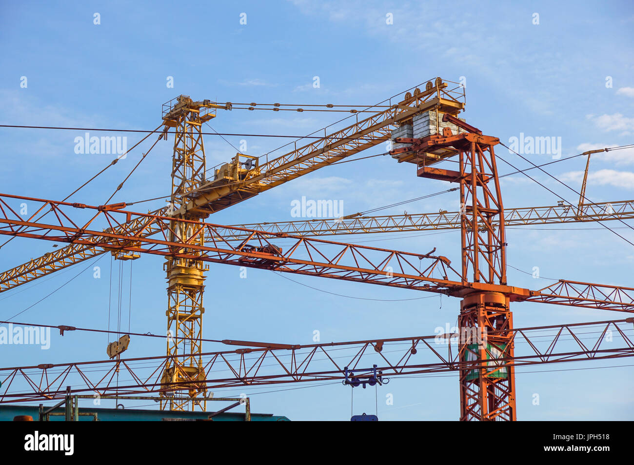 crane tower on sky background at construction site Stock Photo - Alamy