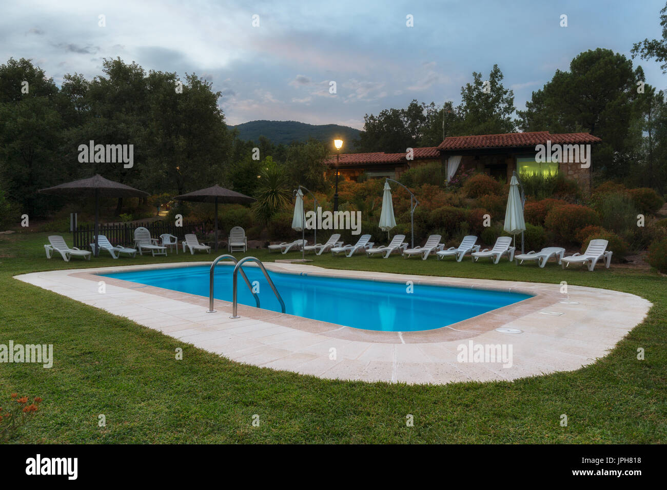 Swimming pool at a resort in the nature Stock Photo - Alamy