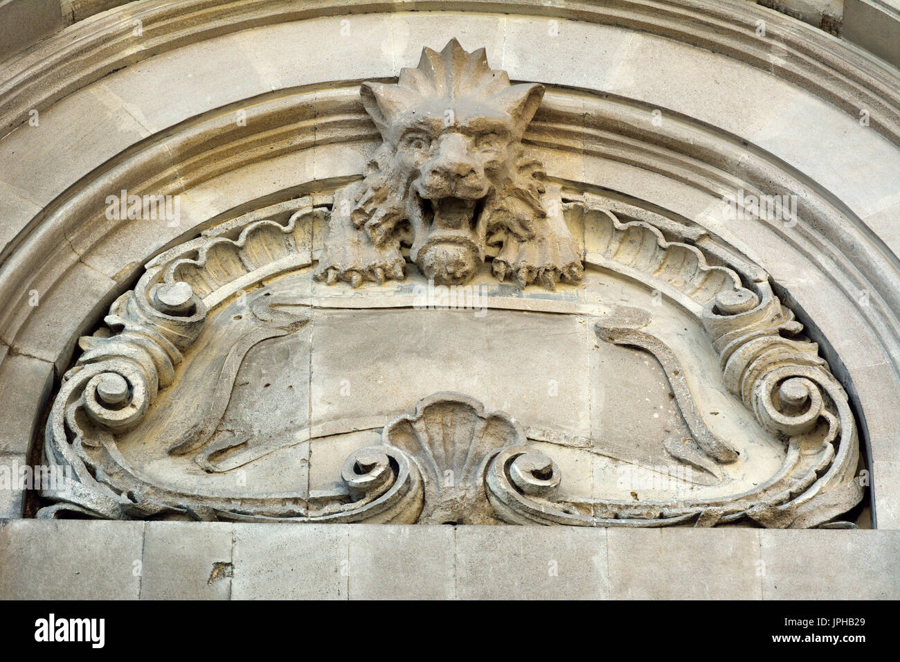 Sculpture of a lion on facade of architectural building in downtown ...