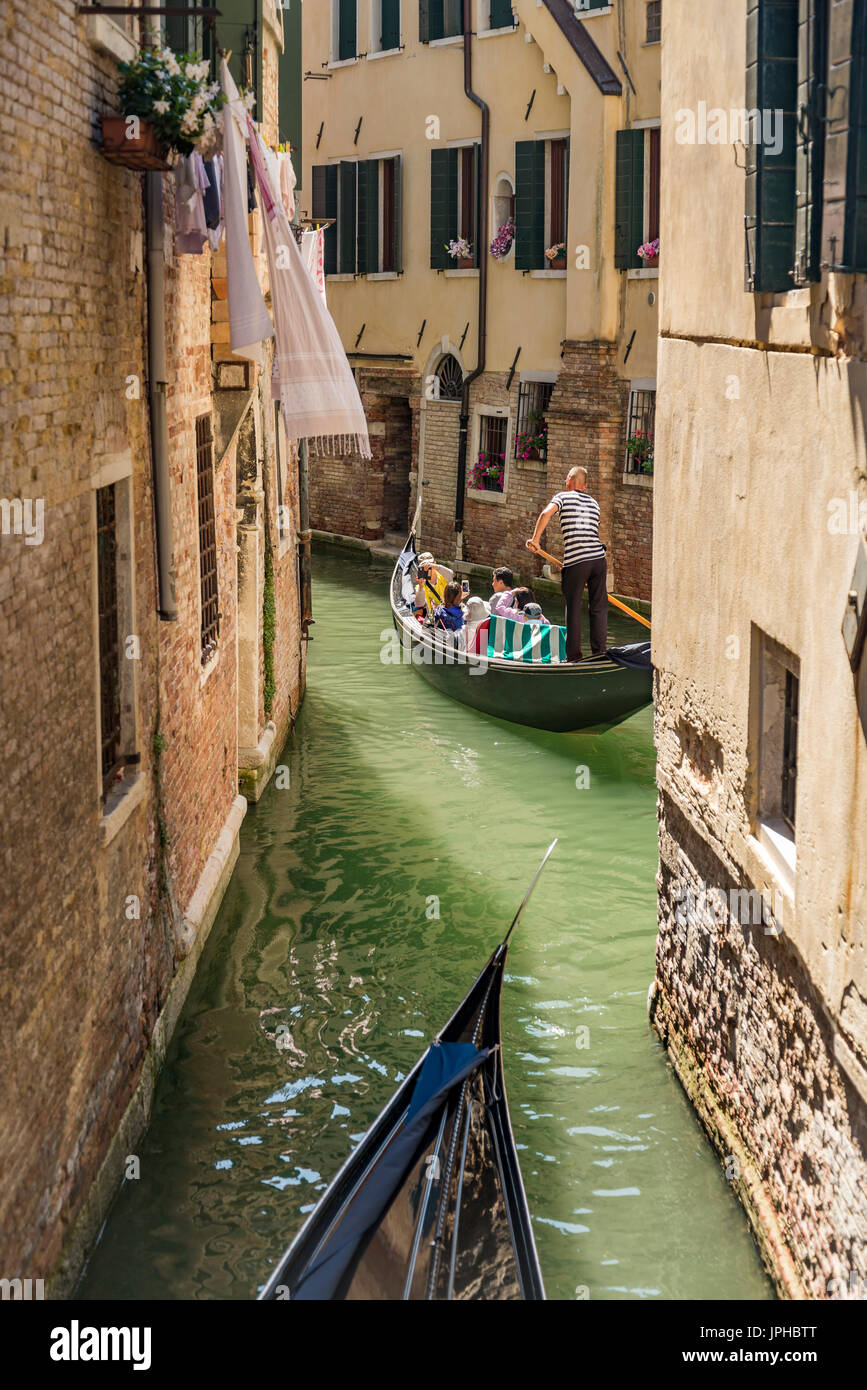 Beautiful view of the canal with a floating gondola Stock Photo - Alamy