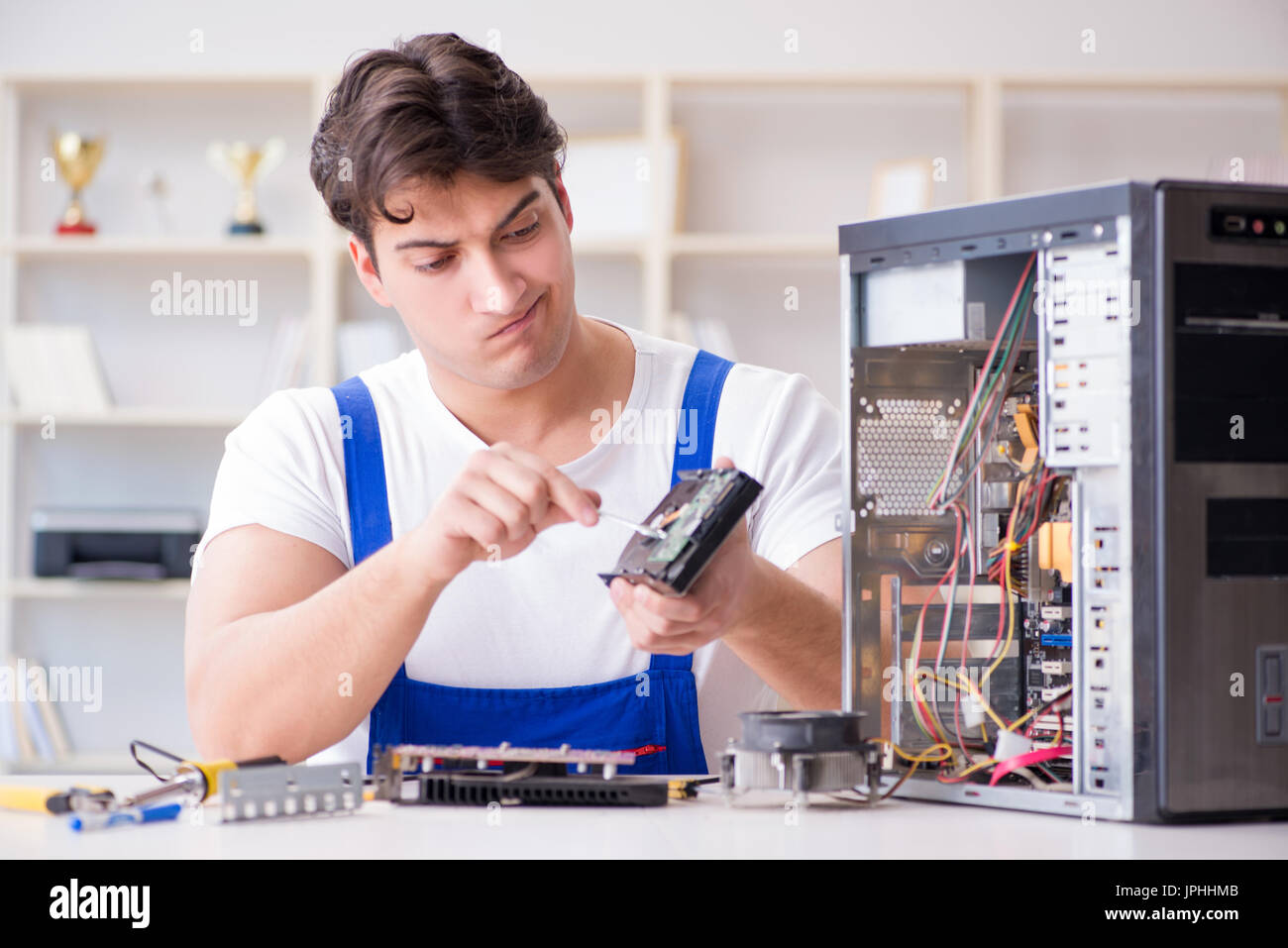 Computer repairman repairing desktop computer Stock Photo - Alamy