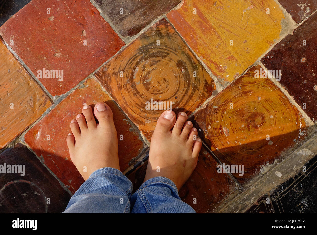 Vintage tile floor with man foot at a temple in Shan State, Myanmar ...