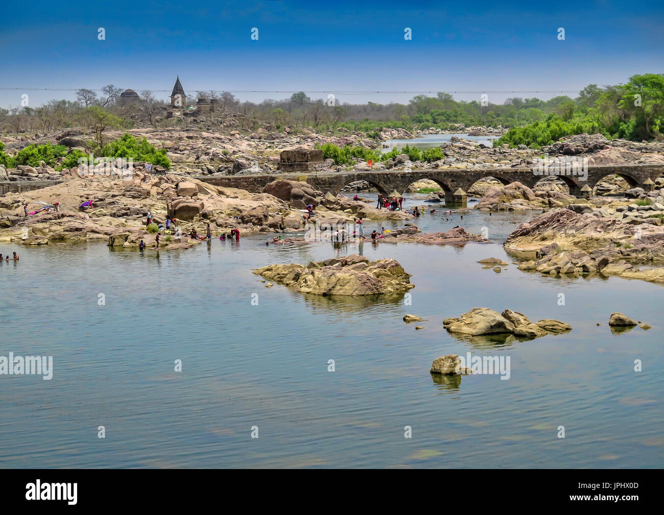 Indian people are bathing and swimming in the Betwa River in Orchha ...