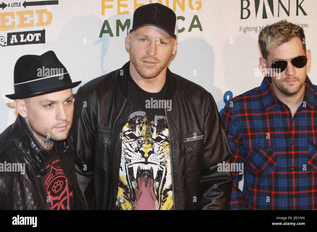 Benji Madden, a guest and Joel Madden arrive at the red carpet for Rock ...