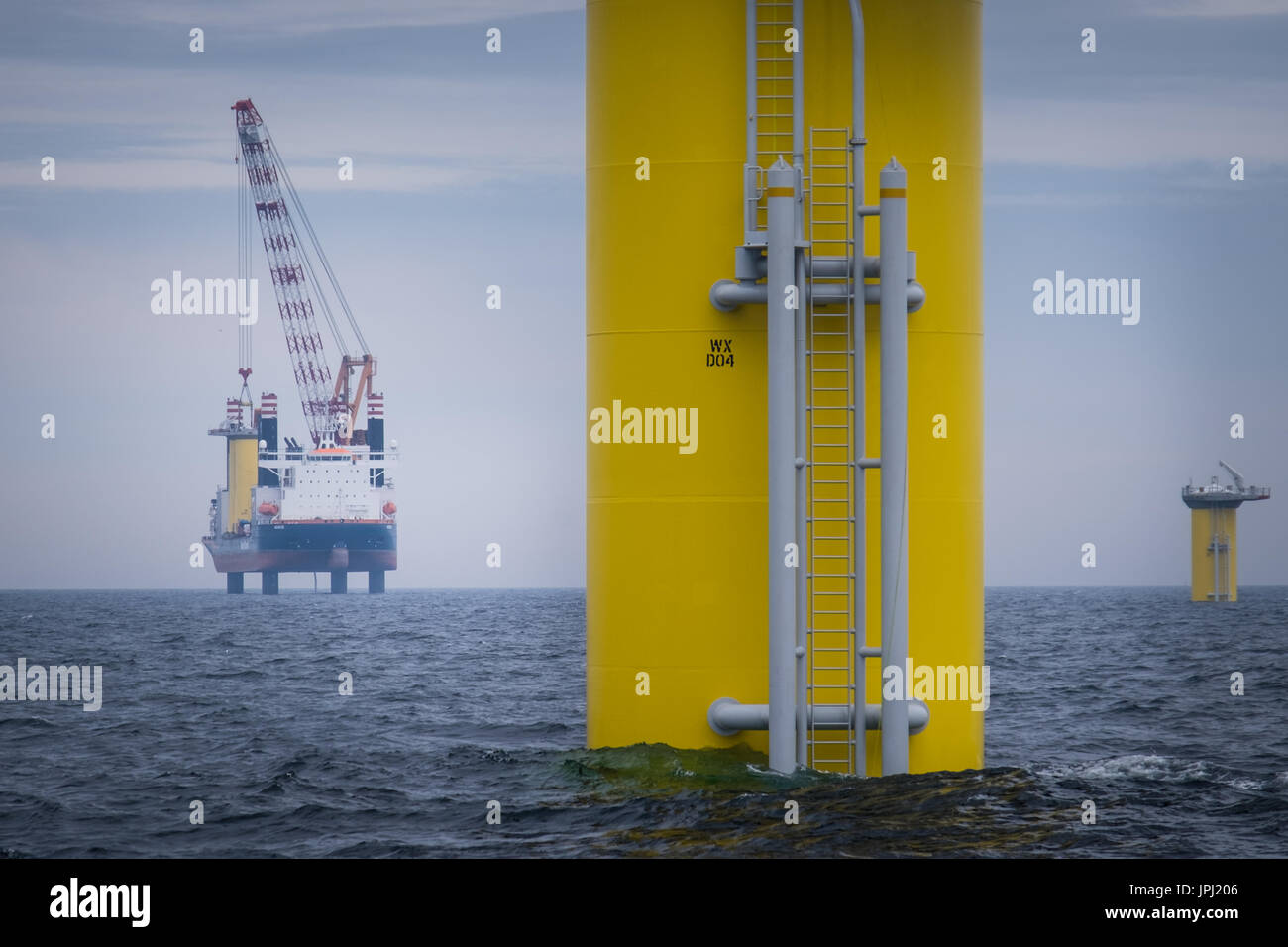 The jack-up vessel, Aeolus, installing the Transition Pieces (TP's) on ...