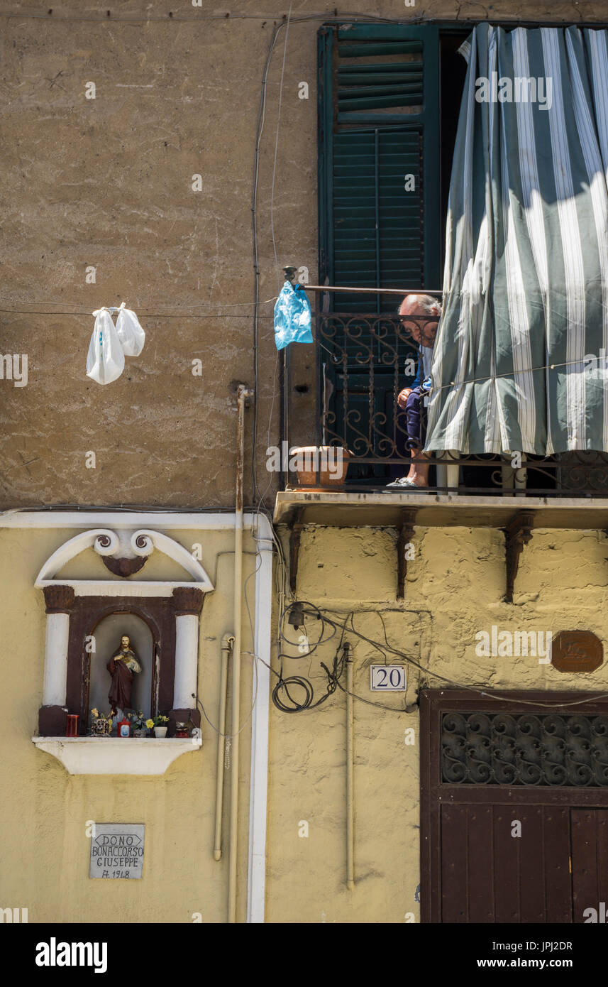 Balcony and shrine on an old house in the Albergheria district of ...
